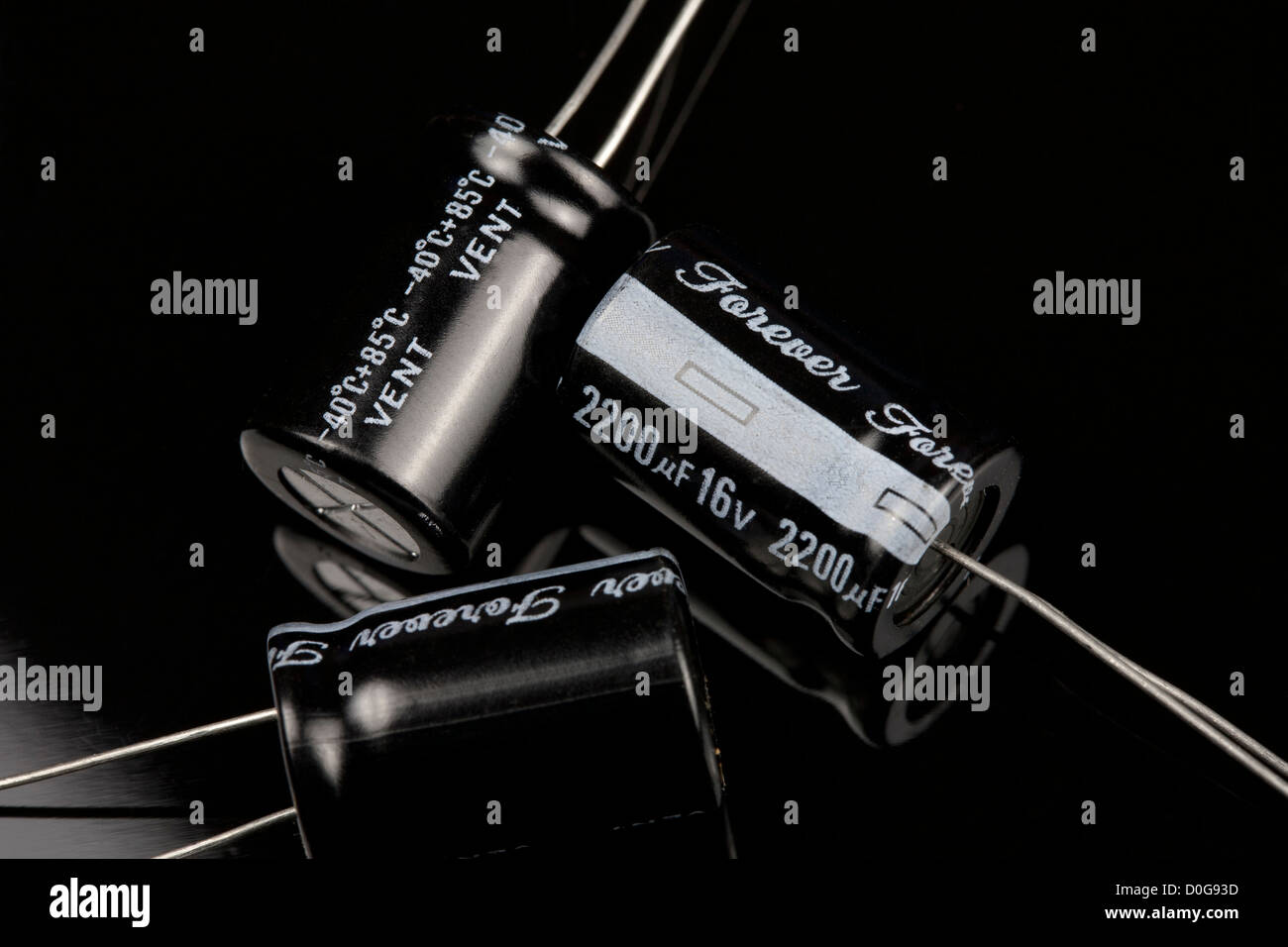 Close up of capacitors on a black background Electrical PCB component ...