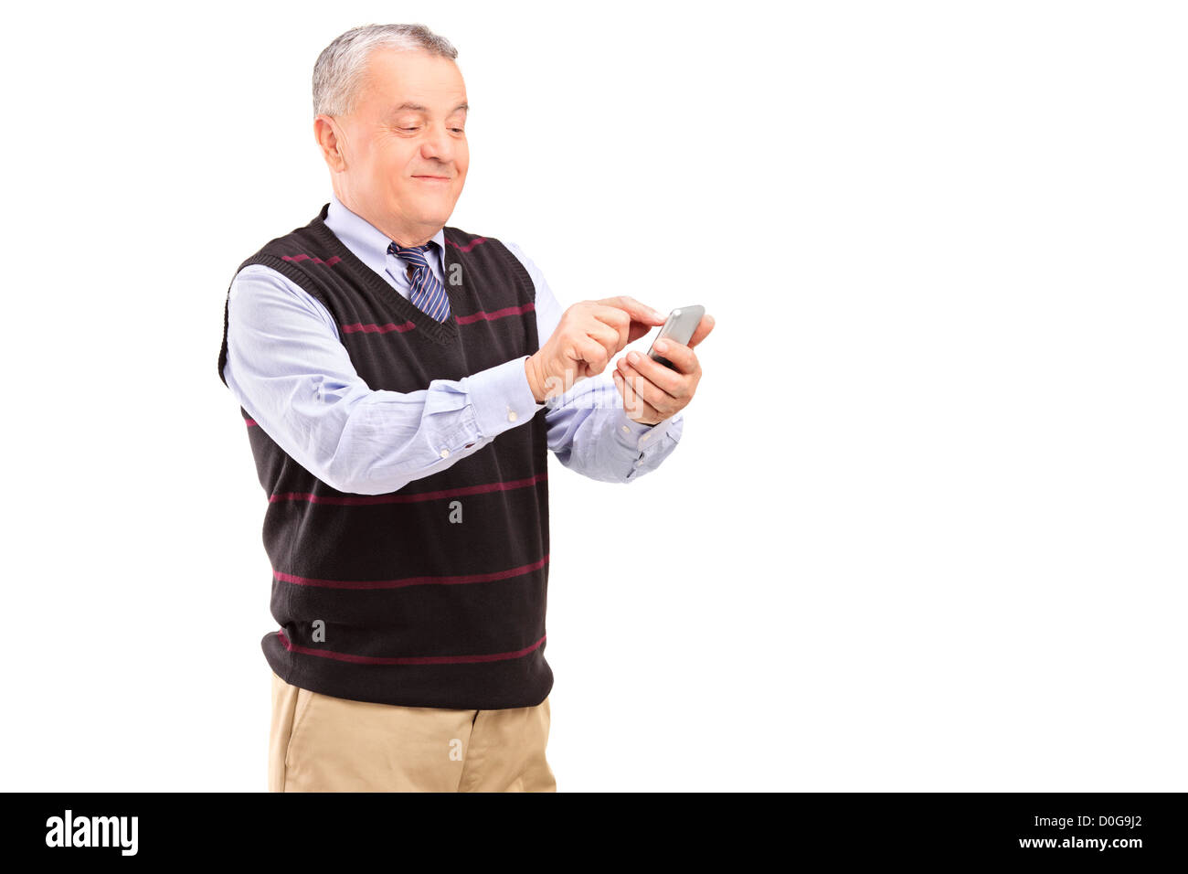 Portrait of a mature gentleman writing sms isolated on white background ...