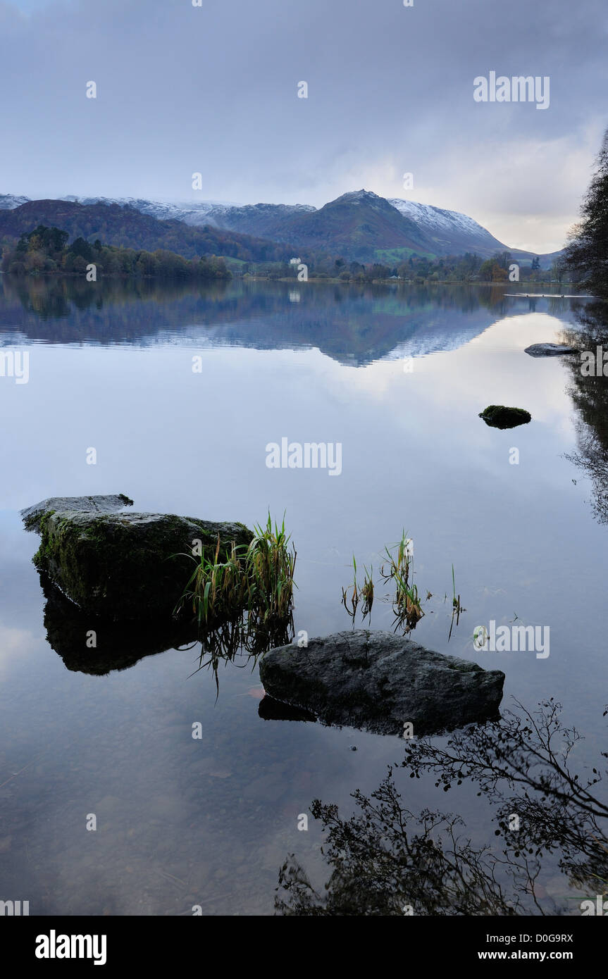 Helm Crag reflected in Grasmere on a calm winter day in the English ...
