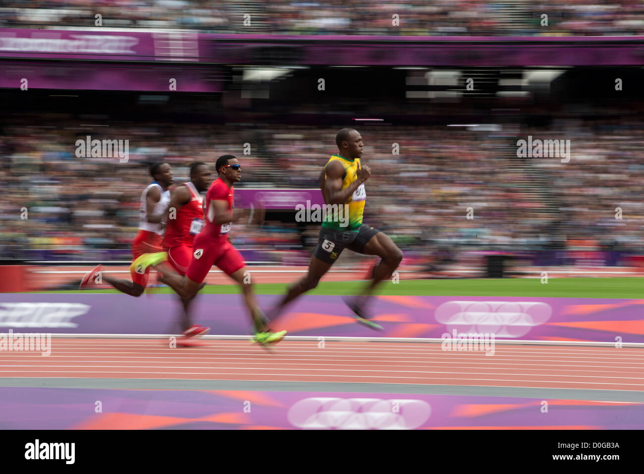 Blurred action of Usain Bolt (JAM) competing in the Men's 100m 1st ...