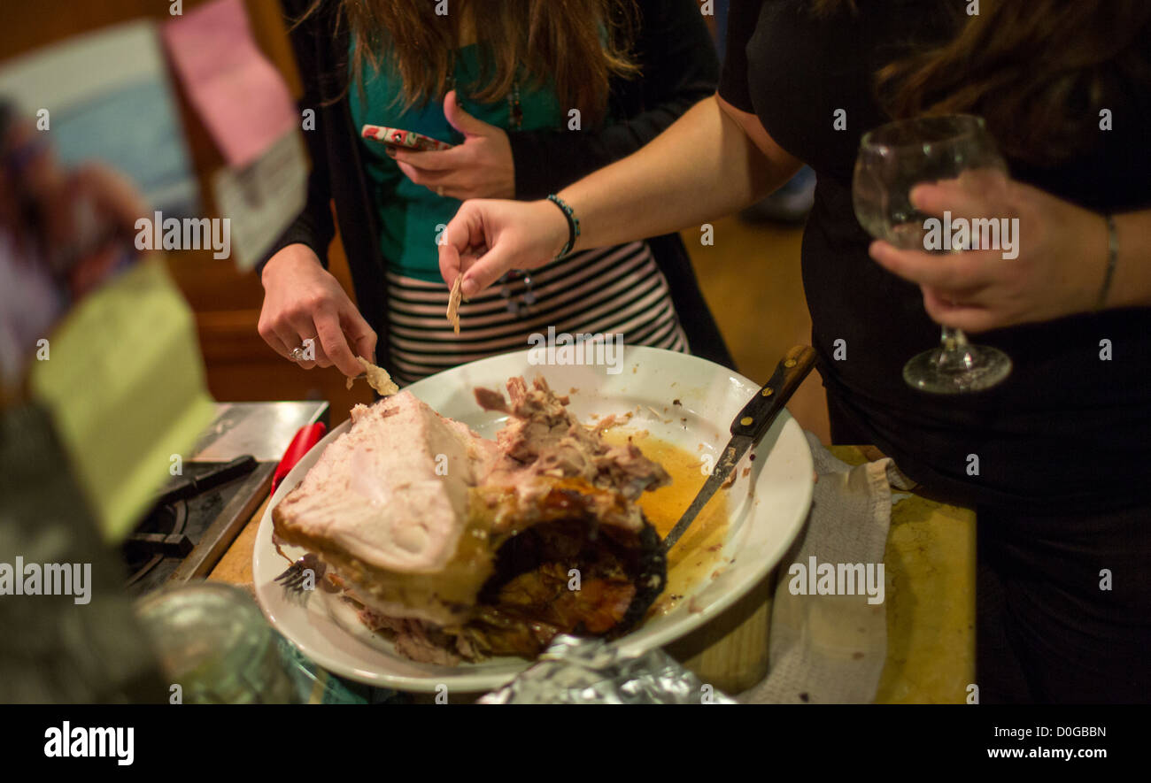 A family serves a traditional roasted turkey during a Thanksgiving Day ...