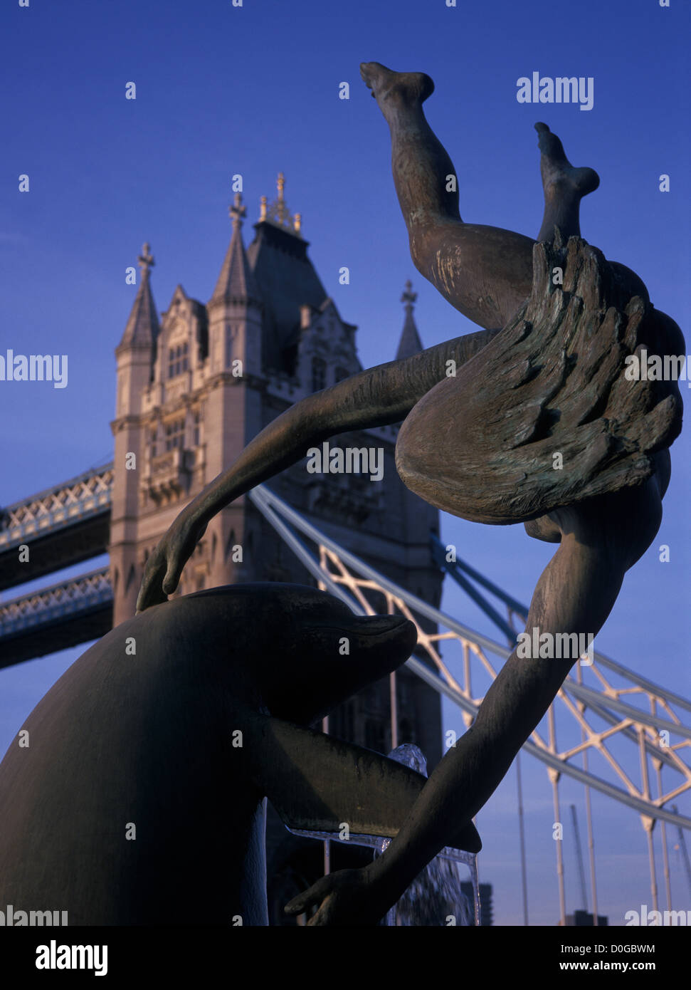 Dolphin and boy statue hi-res stock photography and images - Alamy