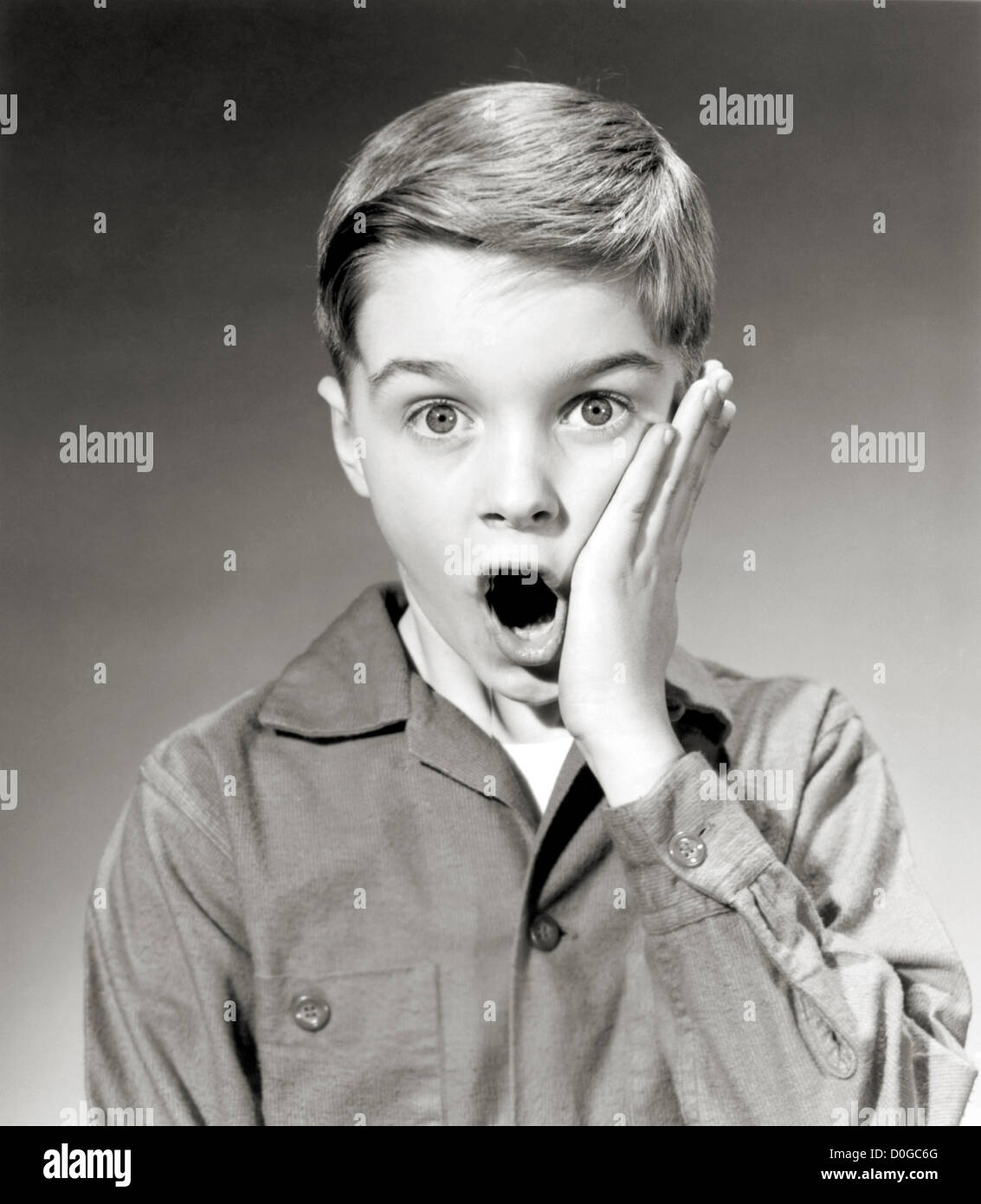 Boy w surprised expression Stock Photo - Alamy
