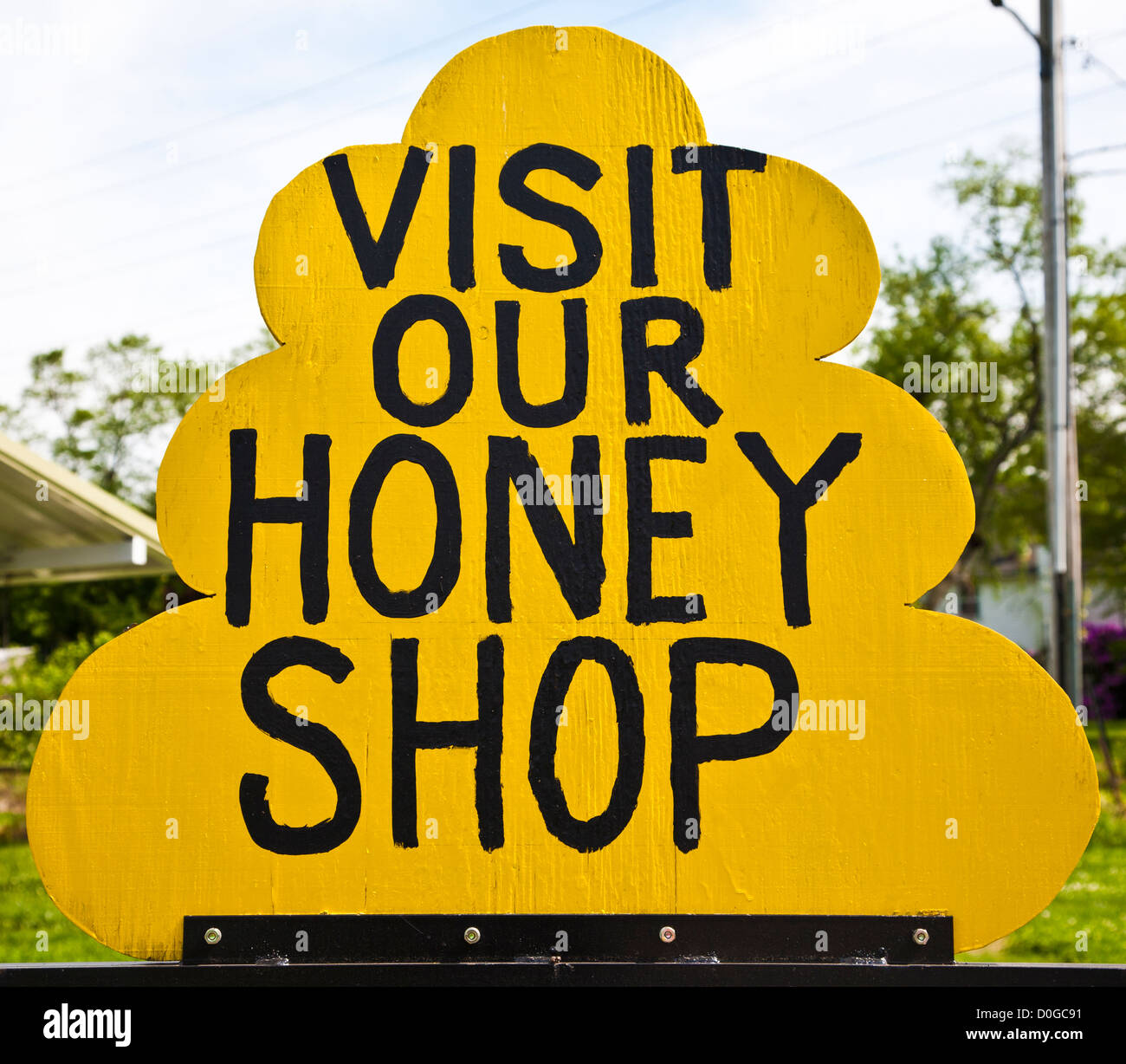 Close-up of a Honey vintage farm shop sign ad on a rural produce farm ...