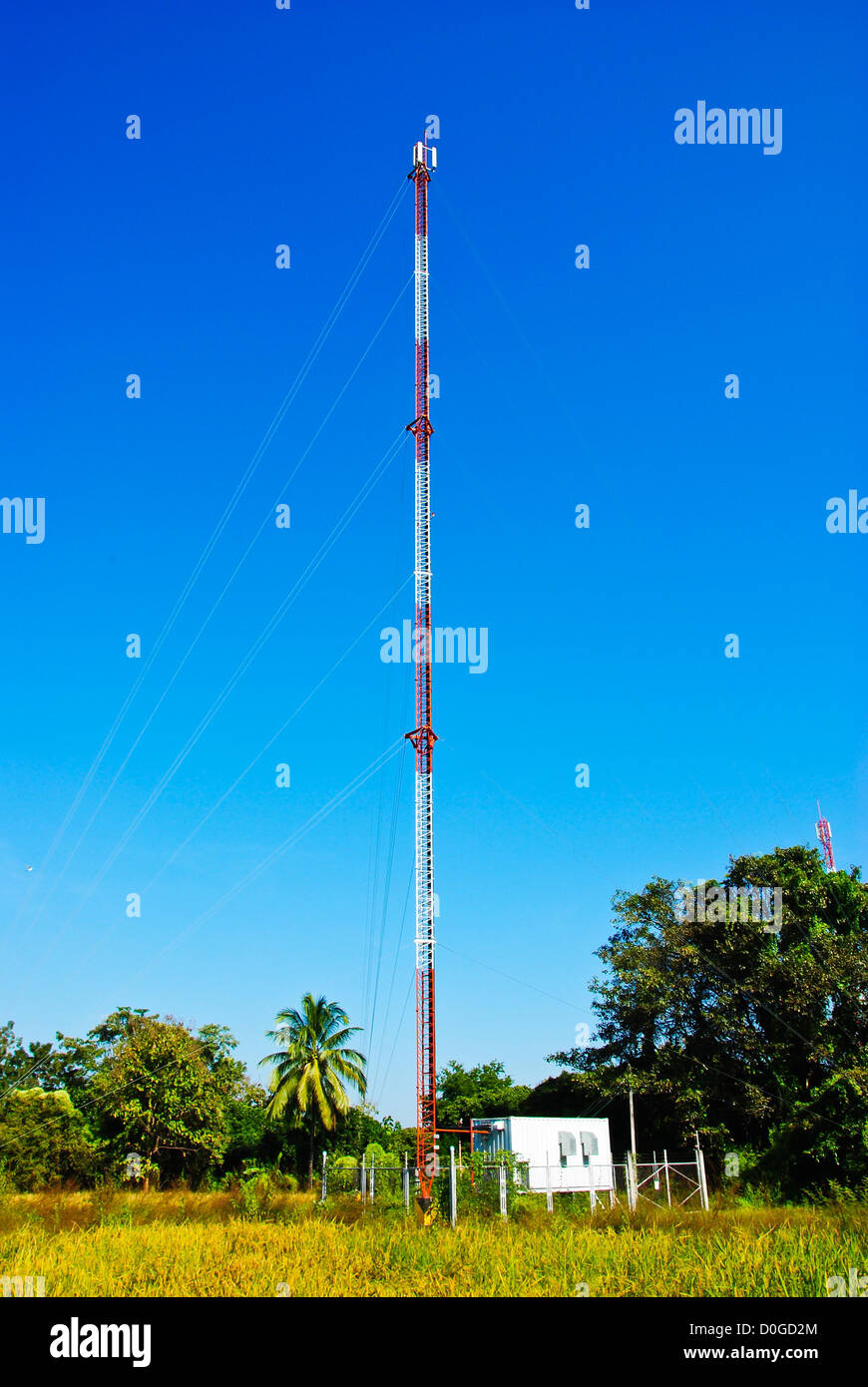 Telecoms tower and blue sky Stock Photo - Alamy