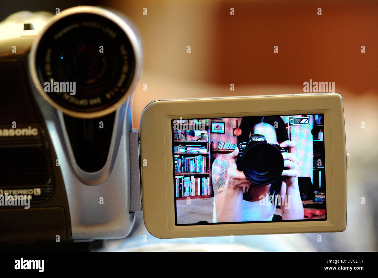 Photographer in the view of a camcorder Stock Photo - Alamy