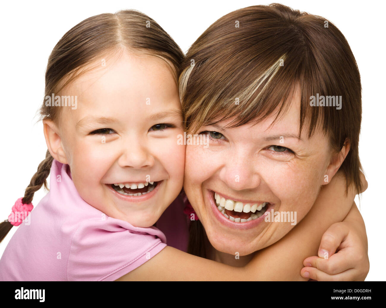 Portrait Of A Happy Mother Hugging Her Daughter Isolated Over White