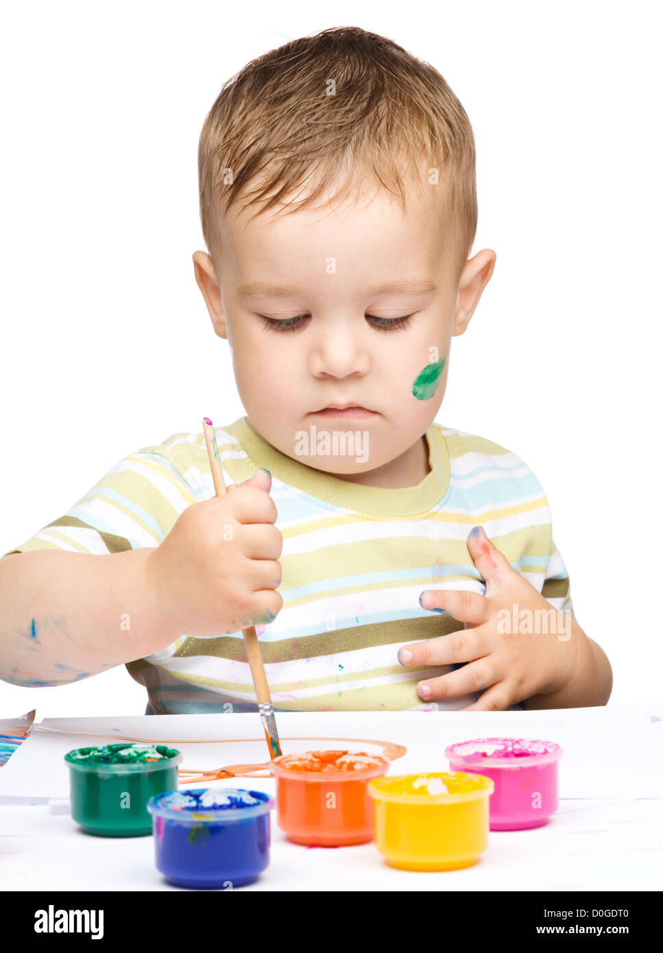 Toddler playing with one colour paint hi-res stock photography and ...