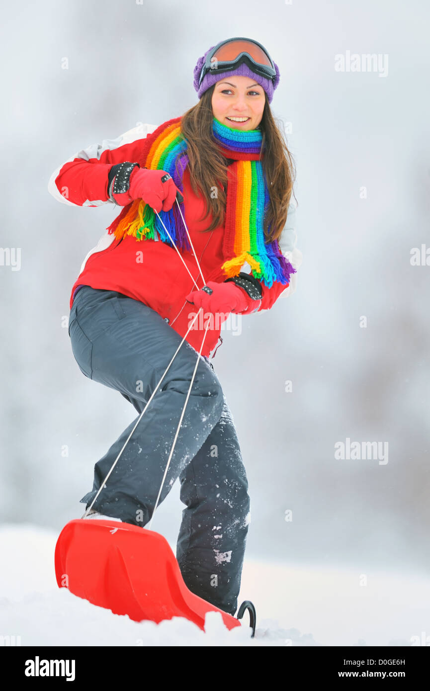girl sliding in the snow Stock Photo - Alamy