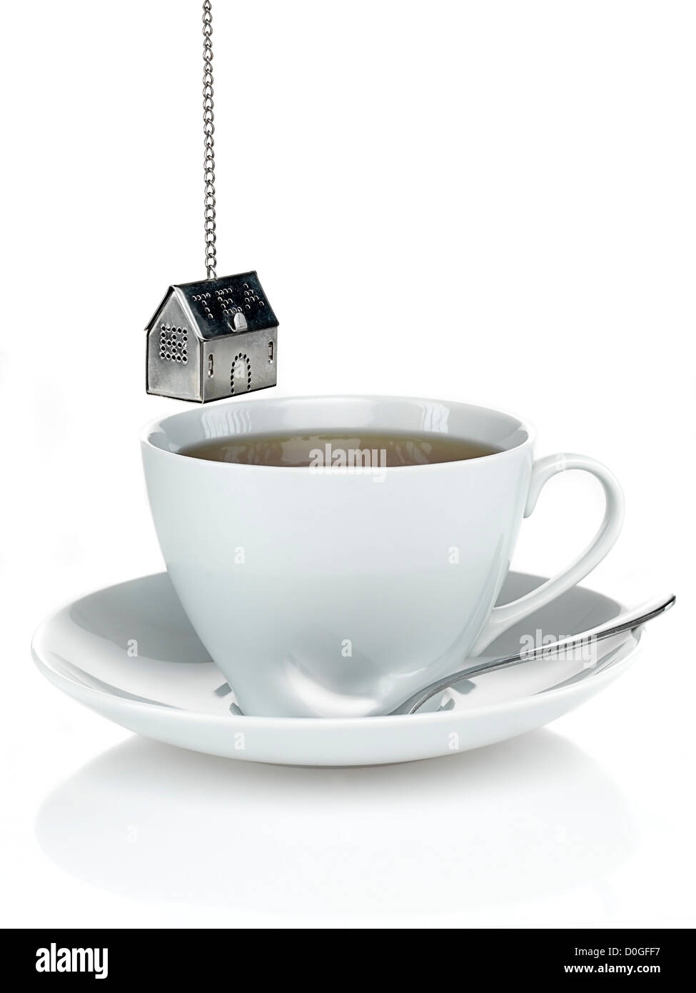 White tea cup with spoon and object infusion Stock Photo - Alamy