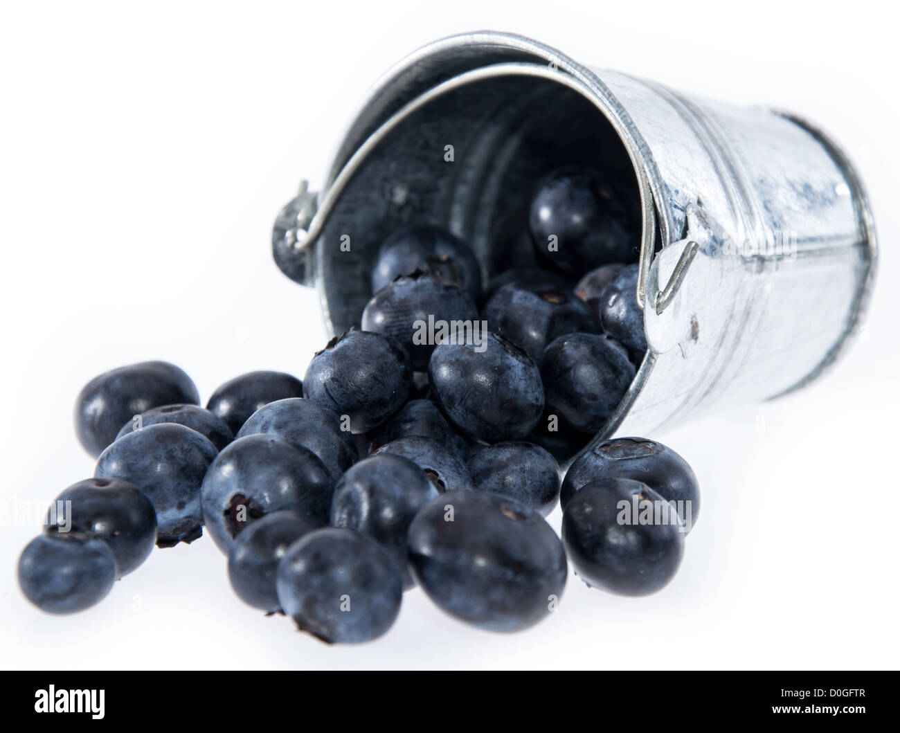 Blueberries in a small bucket isolated on white Stock Photo - Alamy