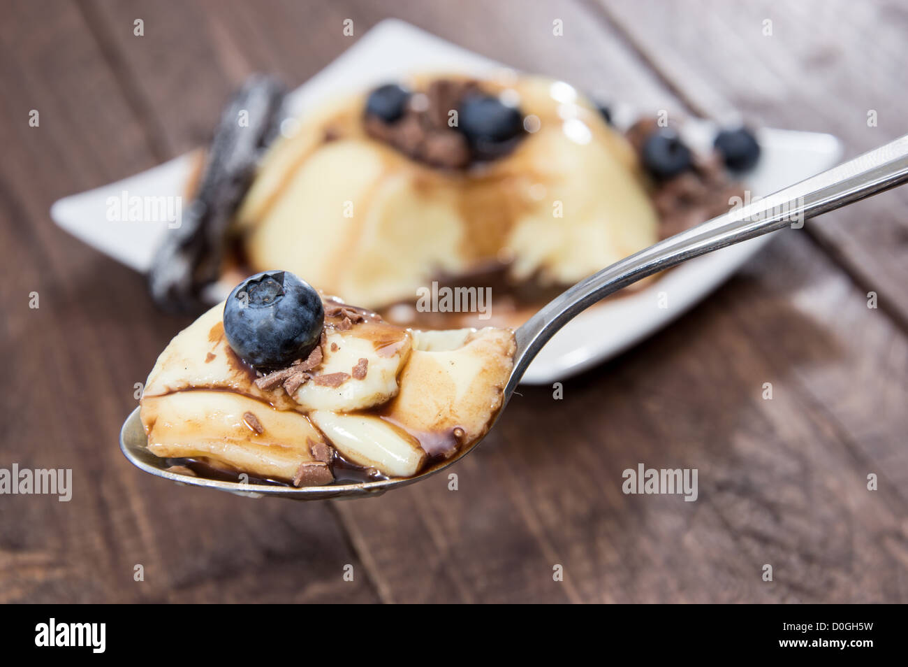 Vanilla Pudding with chocolate sauce on a spoon Stock Photo - Alamy