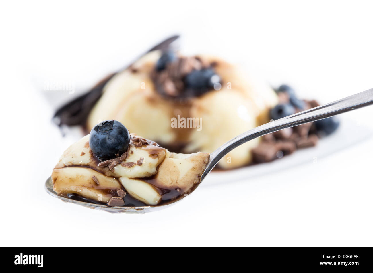 Vanilla Pudding on a spoon against white background Stock Photo - Alamy