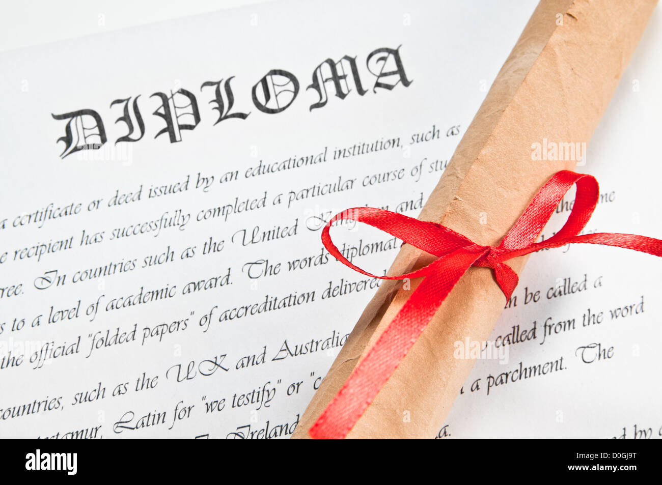 Diploma with red ribbon Stock Photo - Alamy