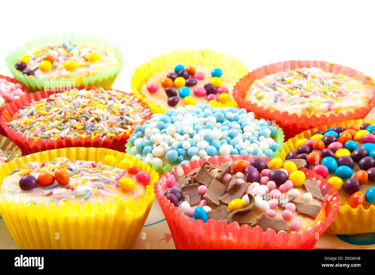 Different kind of cup cakes close up on a white background Stock Photo ...
