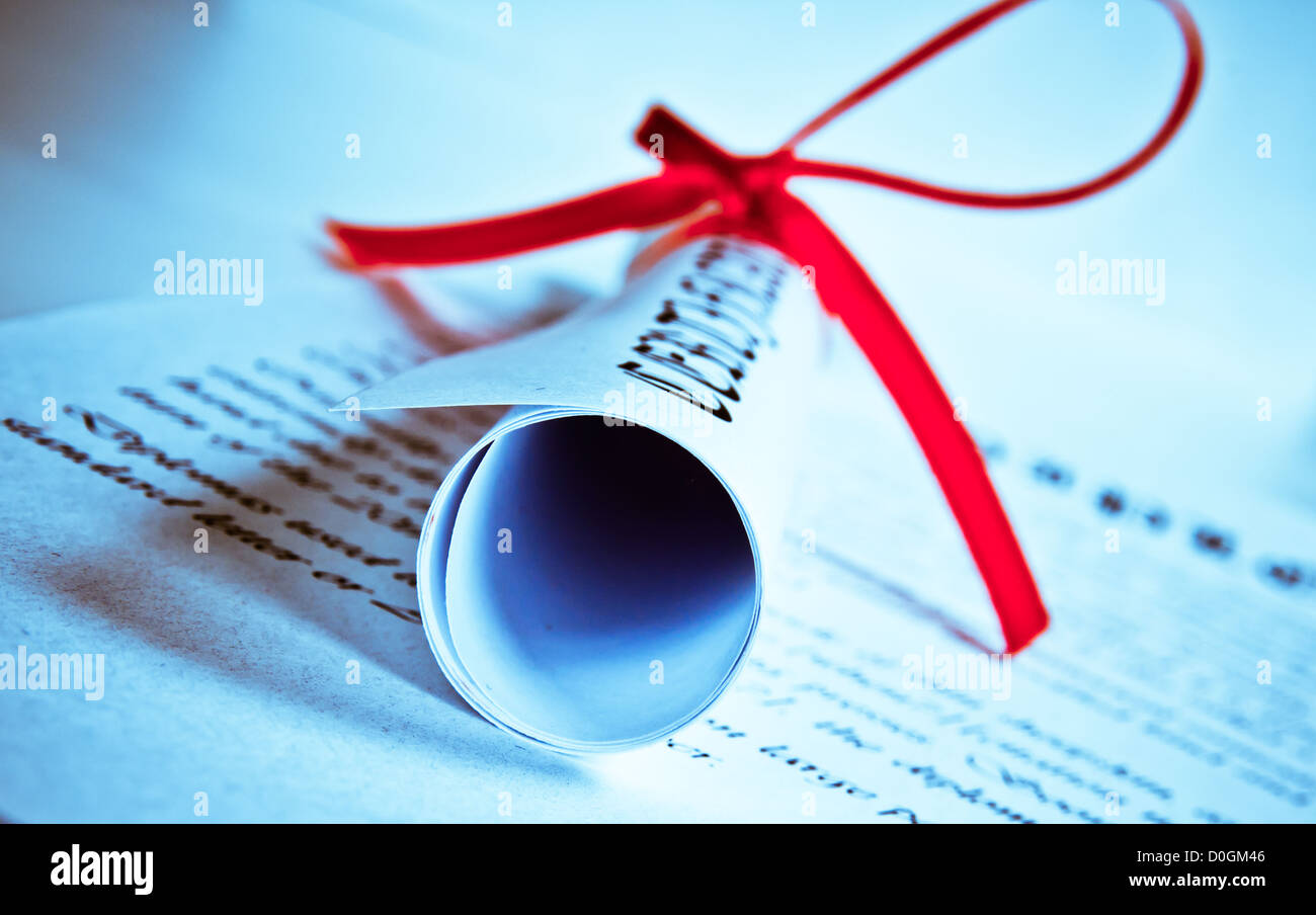 Diploma with red ribbon Stock Photo - Alamy