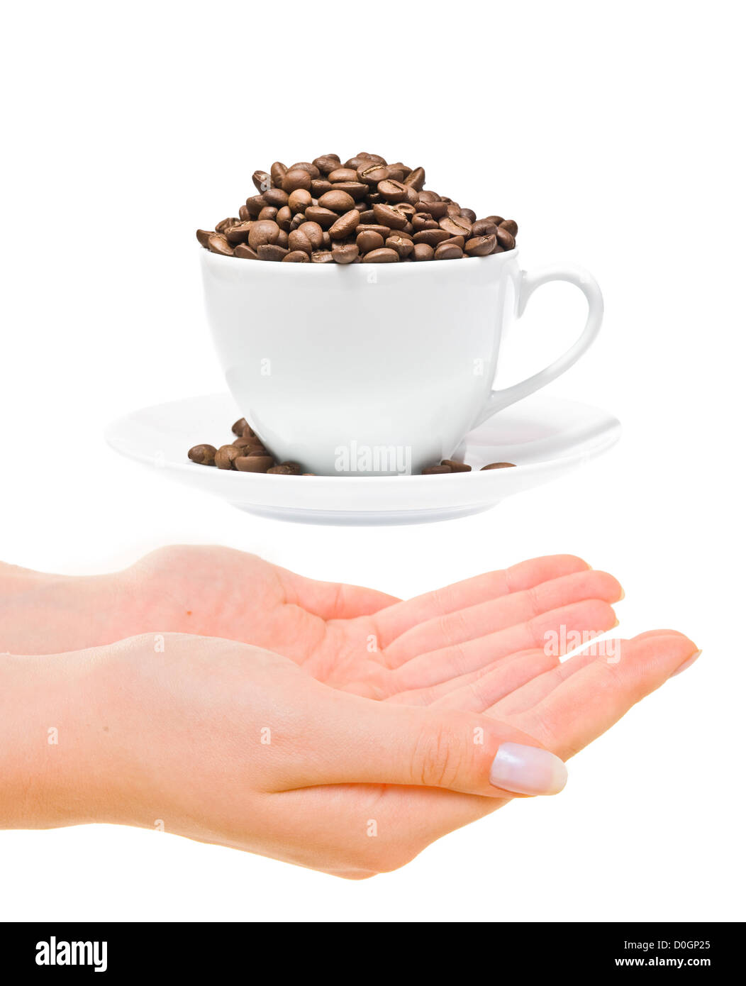 Cup of coffee above hands Stock Photo - Alamy