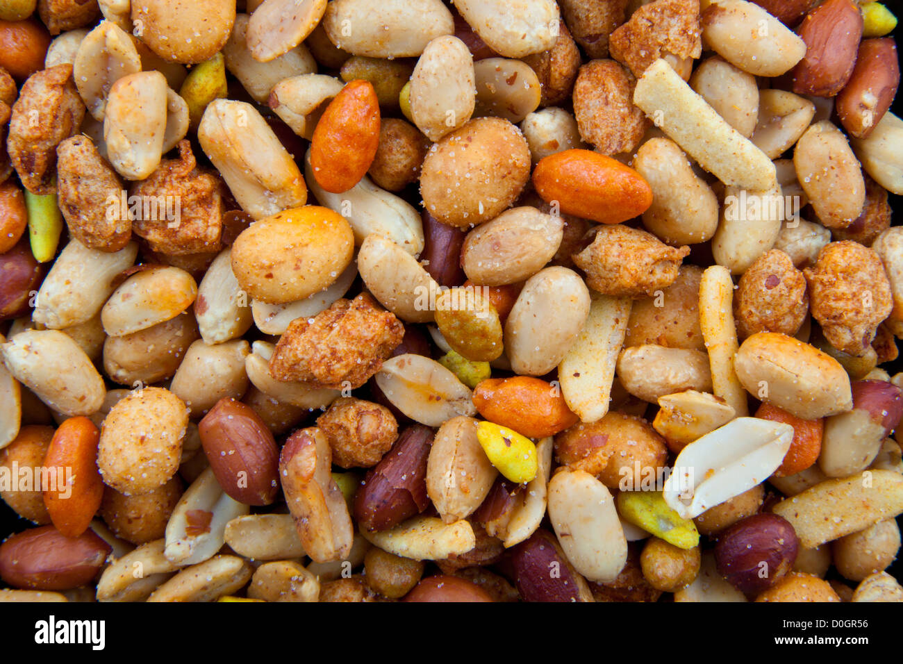 Different kind of peanuts used as background Stock Photo - Alamy
