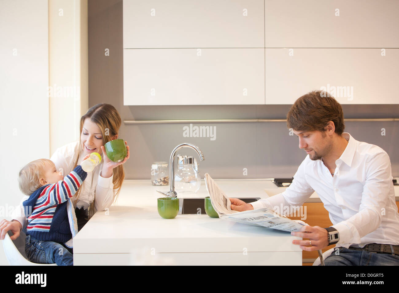 family in the kitchen Stock Photo - Alamy