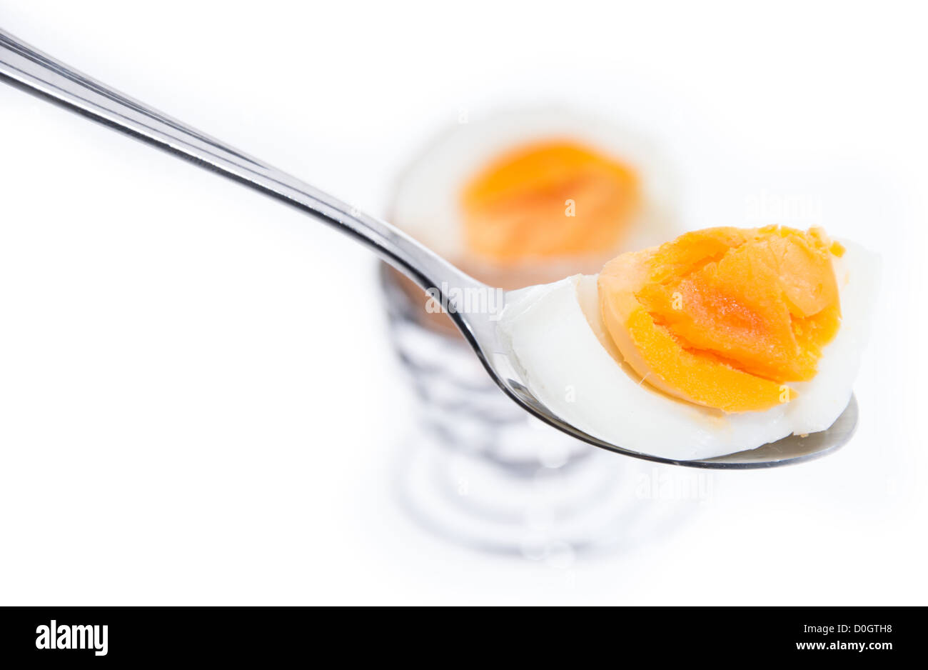 Breakfast Egg on a spoon (white background Stock Photo - Alamy