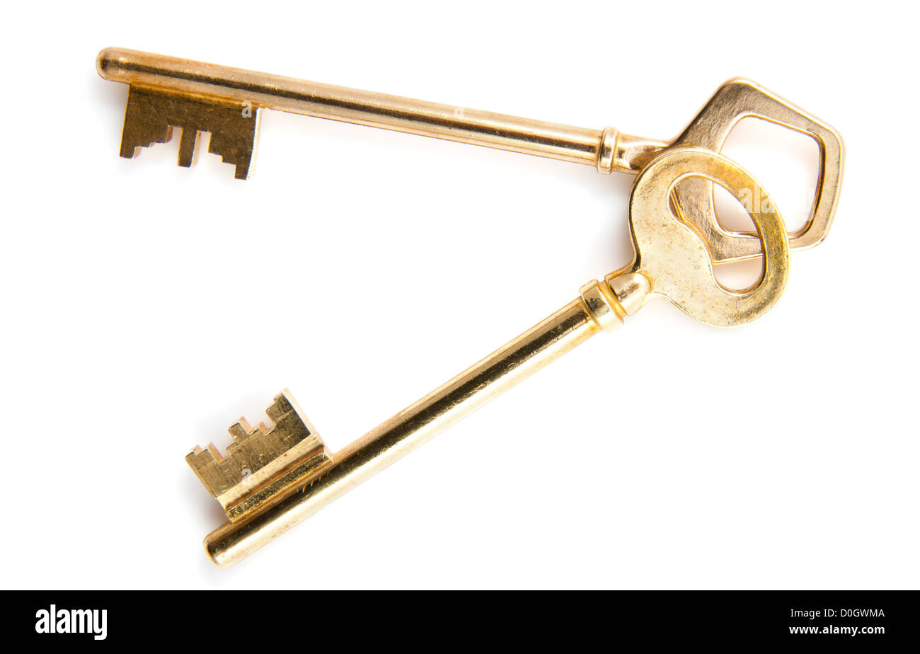 Two gold old keys isolated over white Stock Photo - Alamy