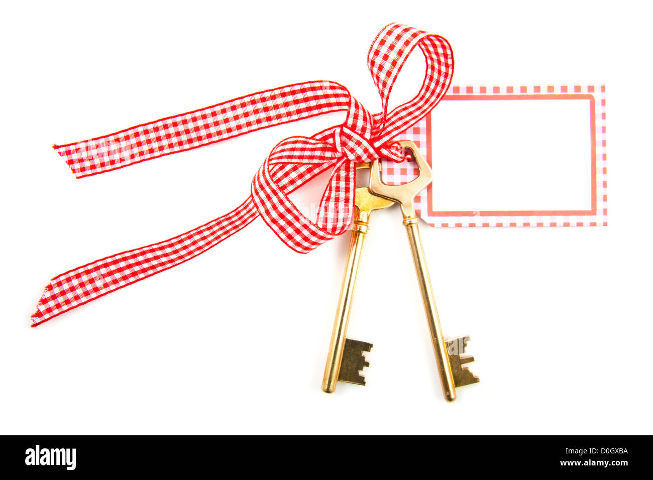 Two golden keys on a ribbon isolated over white Stock Photo - Alamy