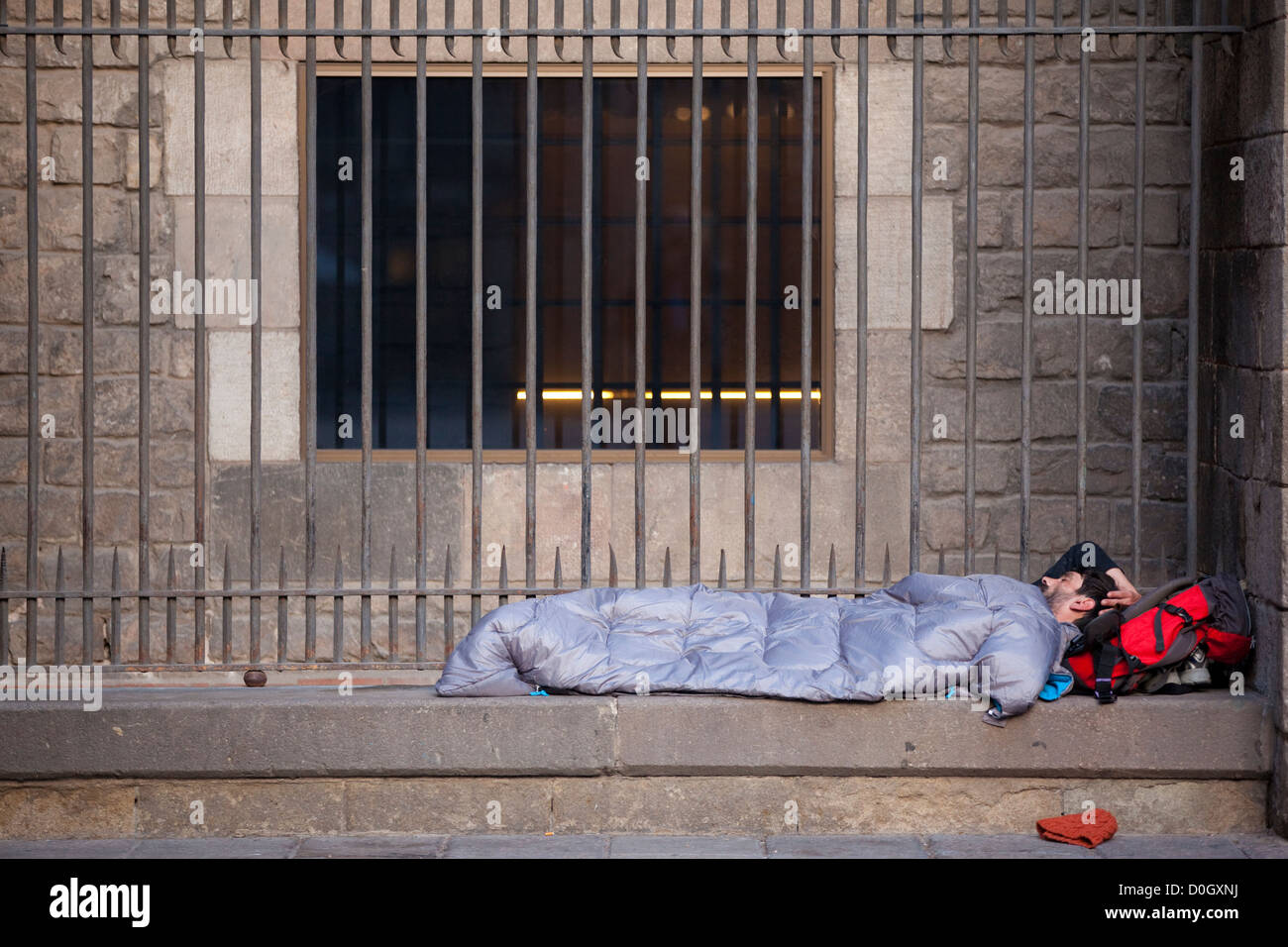 Homeless man sleeping in the 14th Century Medieval Square, Plaça Del ...