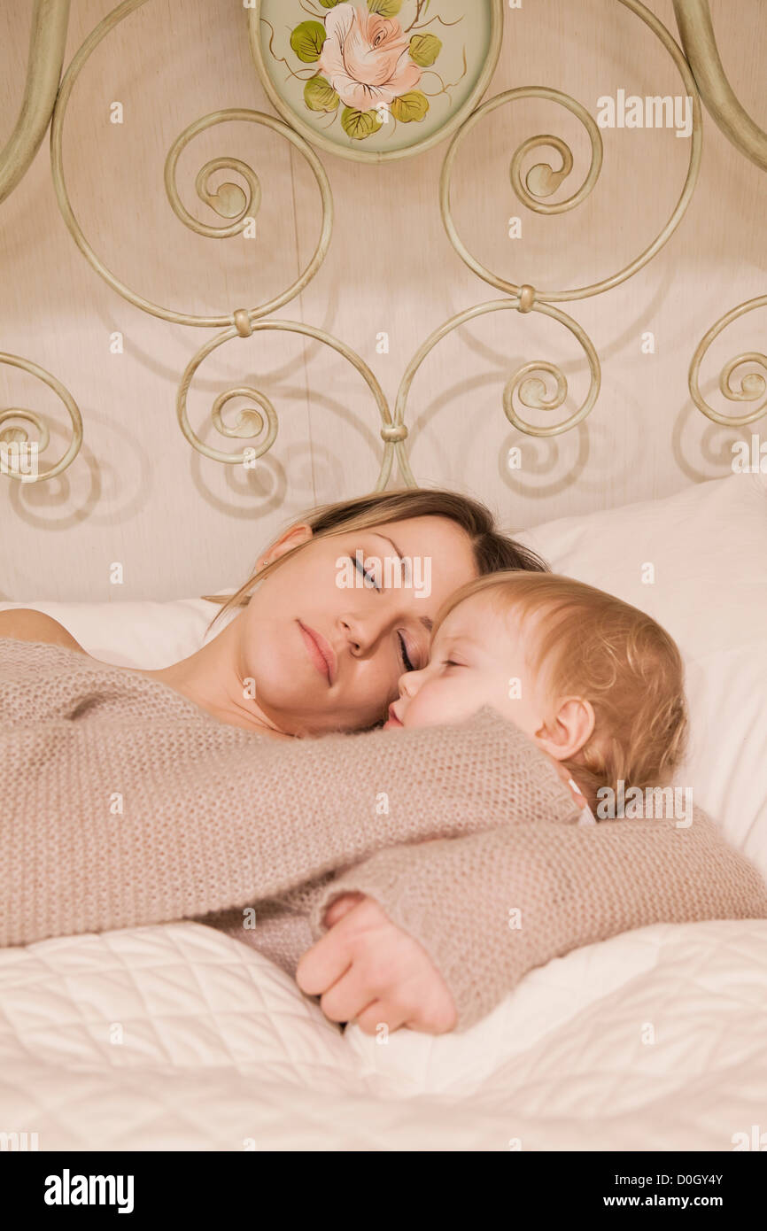 Mother with her two sleeping sons hi-res stock photography and images ...