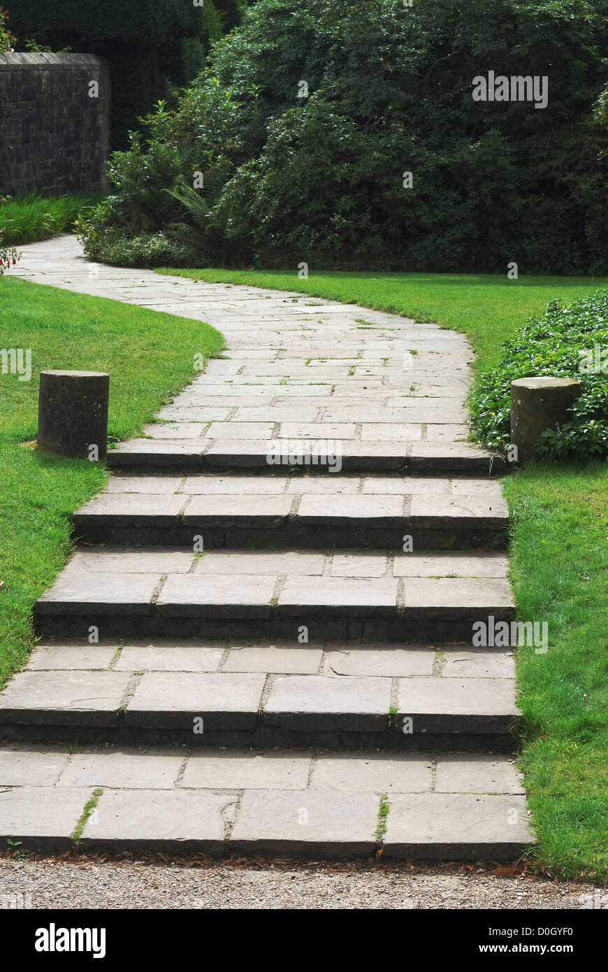 Paved pathway with steps in an English country garden Stock Photo - Alamy