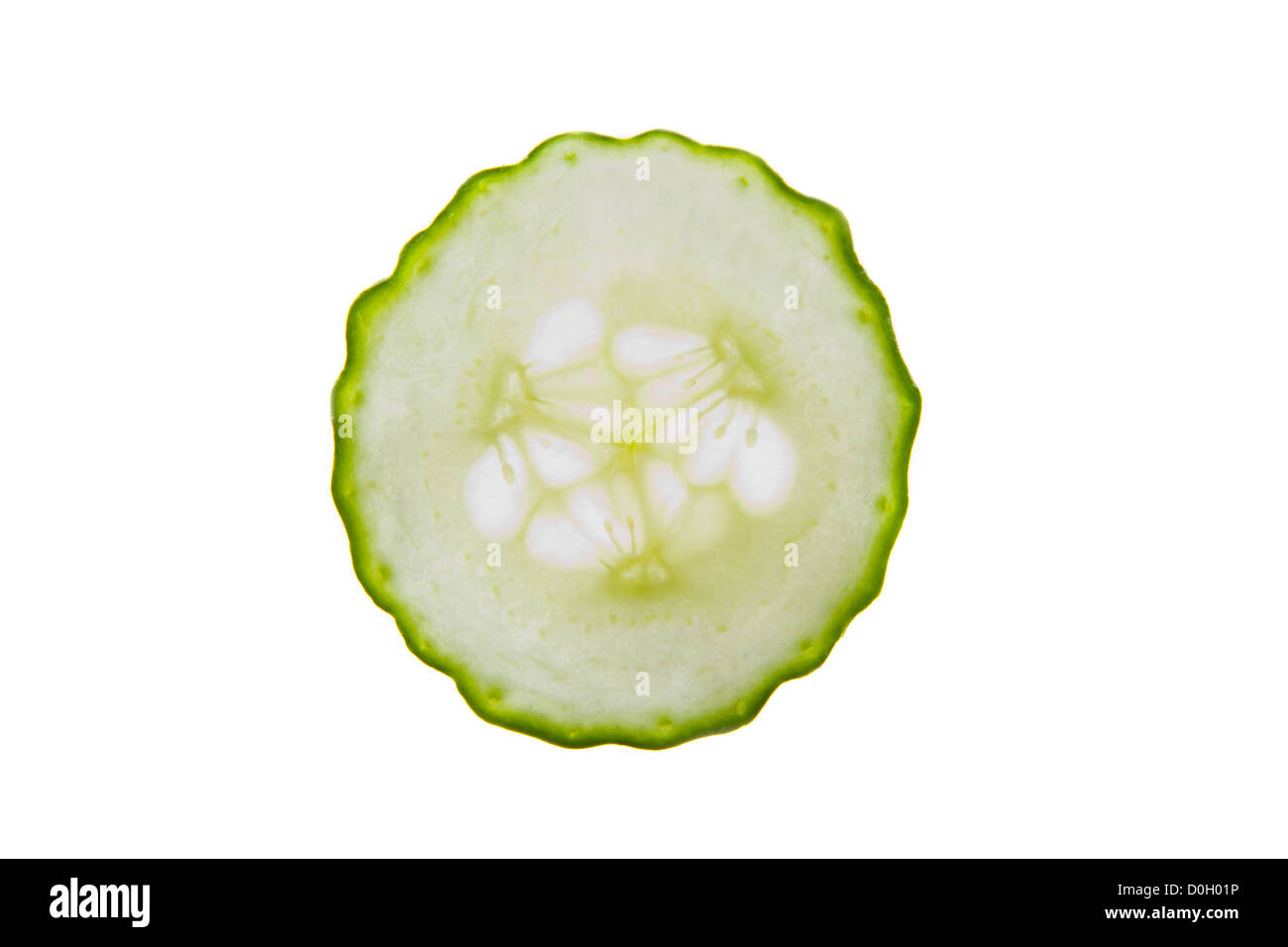 Thin slice of cucumber isolated over white Stock Photo - Alamy