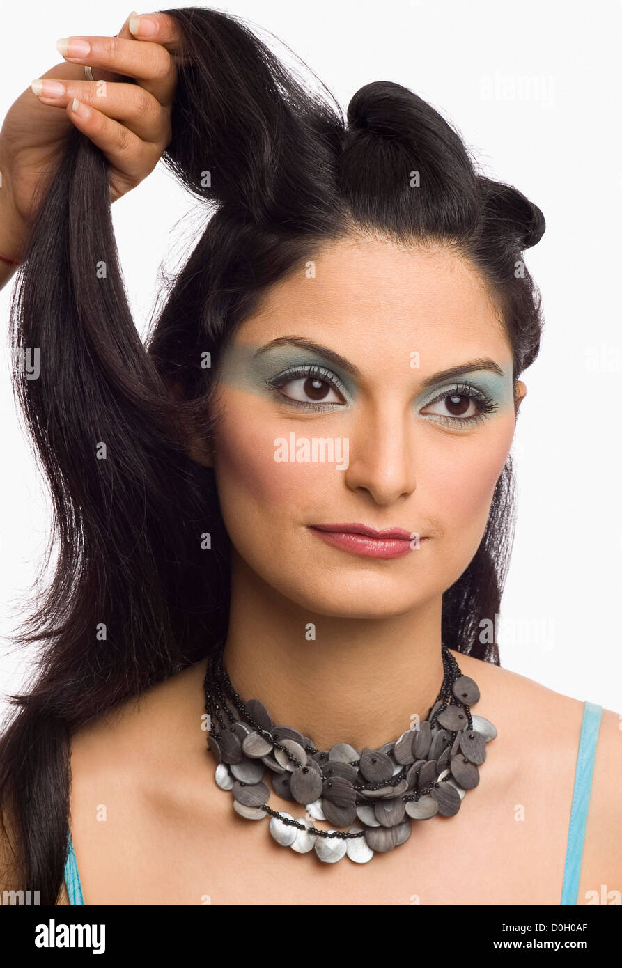 Person's hand styling a young woman's hair Stock Photo - Alamy