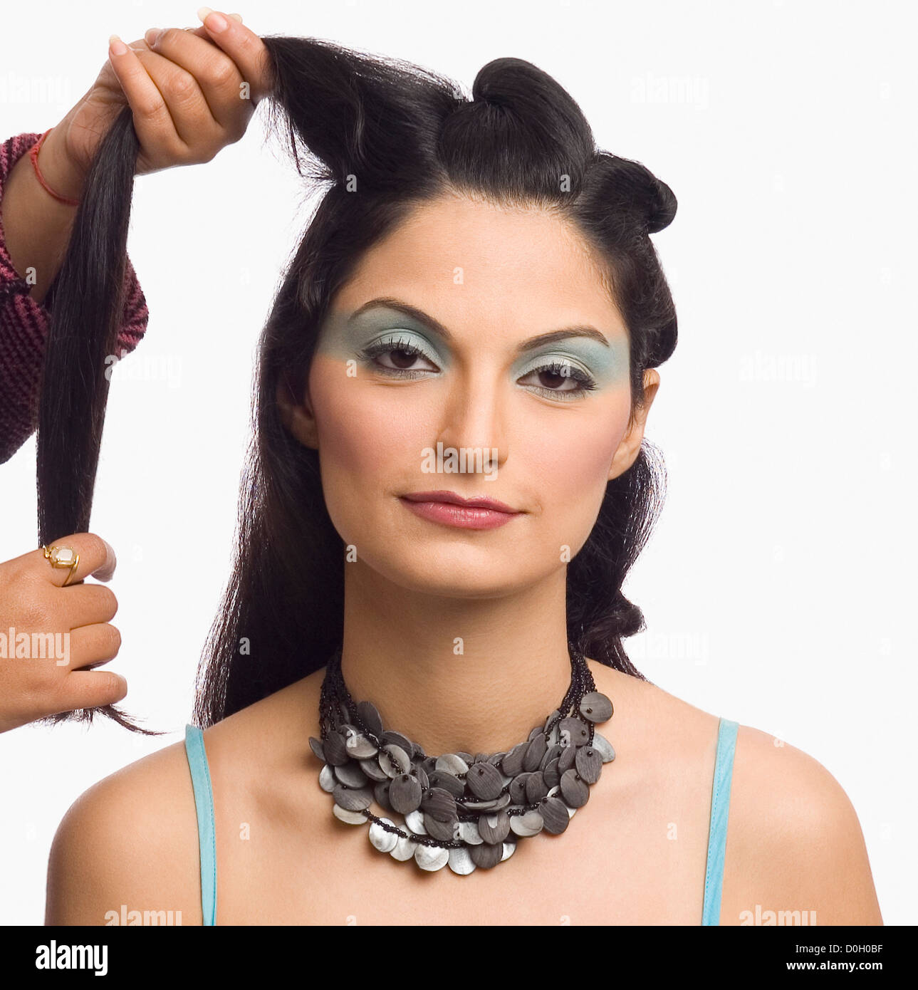 Person's hands styling a young woman's hair Stock Photo - Alamy