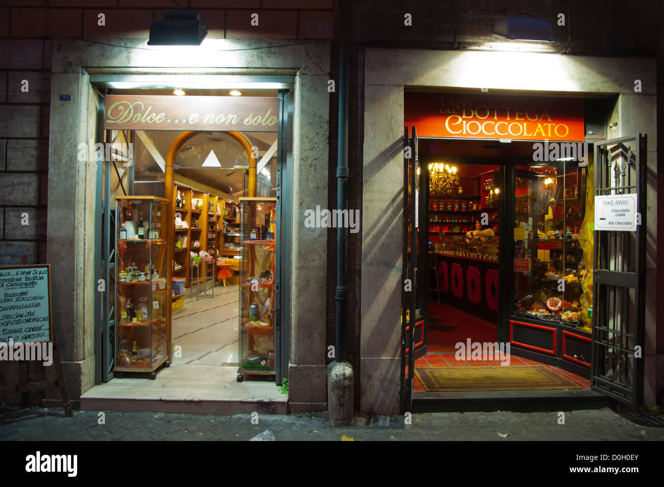 Shops at night along Via Cavour street central Rome the Lazio region ...
