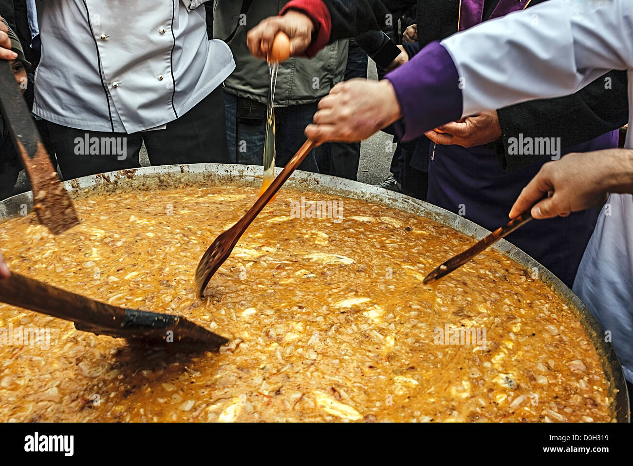 Giant omelet from 1000 eggs, prepared and mixed with wooden utensils by ...