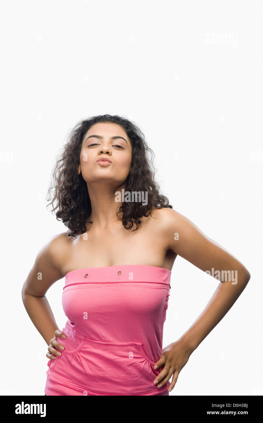 Portrait of a young female fashion model puckering Stock Photo - Alamy