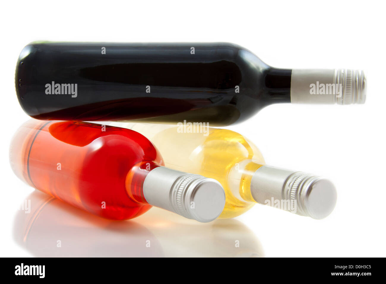 Three bottles of wine isolated over white Stock Photo - Alamy