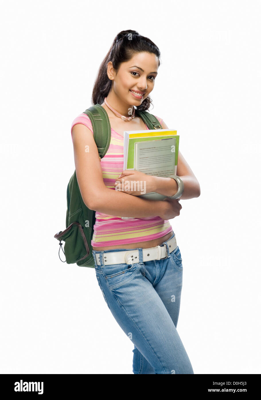 Portrait of a female college student holding files Stock Photo - Alamy
