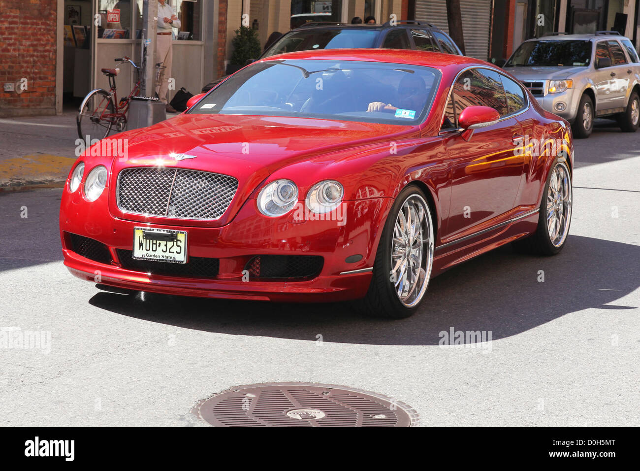 Rapper Ice T arrives in a bright red Bentley Continental GT Mercedes ...