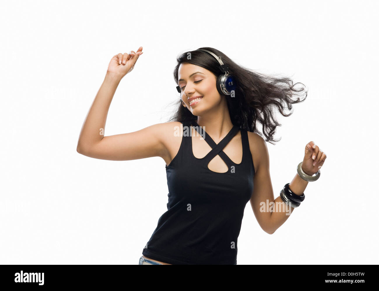 Young woman dancing listening music hi-res stock photography and images ...