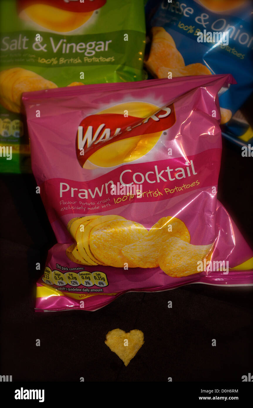 A heart shaped crisp amongst branded bags of crisps Stock Photo - Alamy