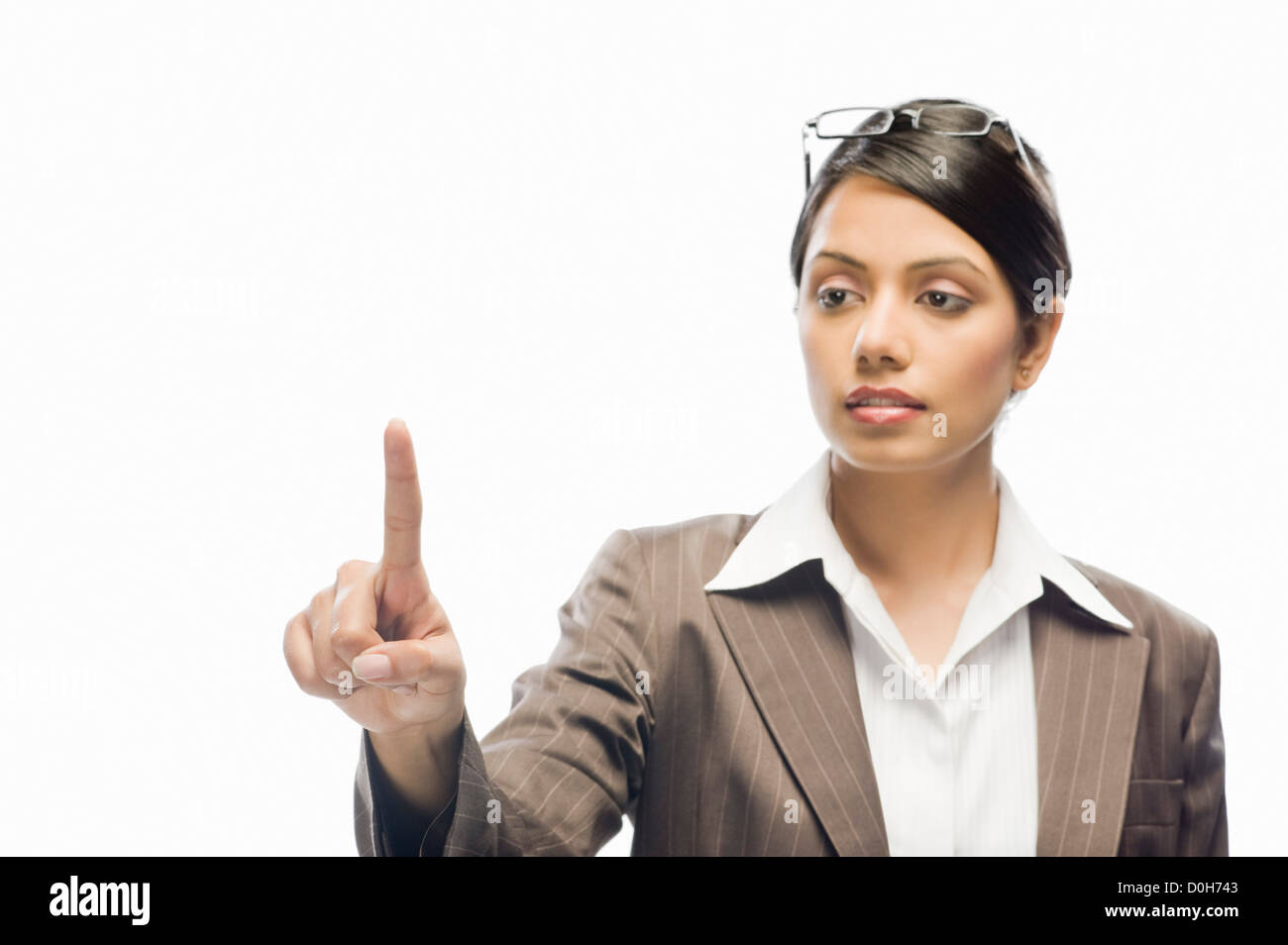 Businesswoman showing her index finger against a white background Stock ...