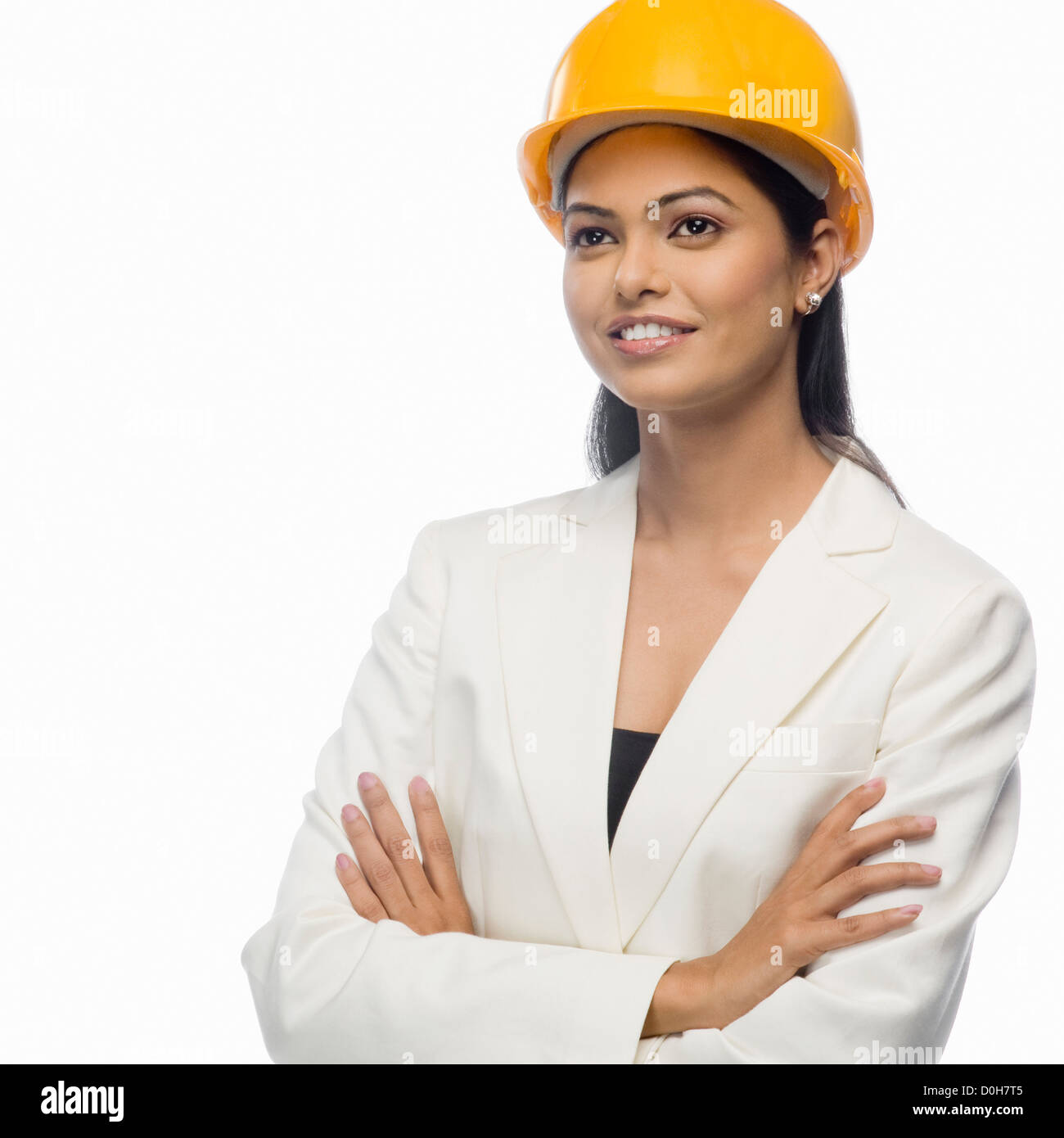Female architect smiling with her arms crossed Stock Photo - Alamy