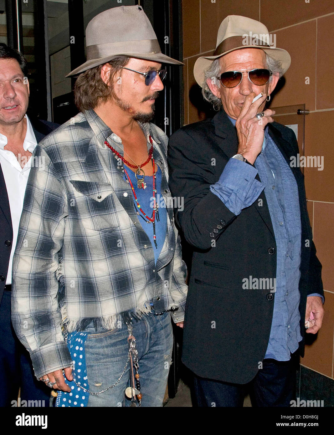 Johnny Depp and Keith Richards both wearing fedora hats and sunglasses ...