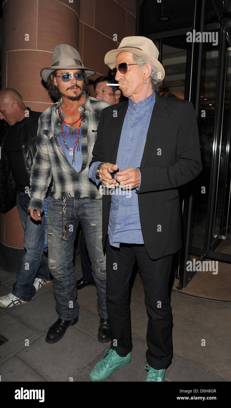 Johnny Depp and Keith Richards both wearing fedora hats and sunglasses ...