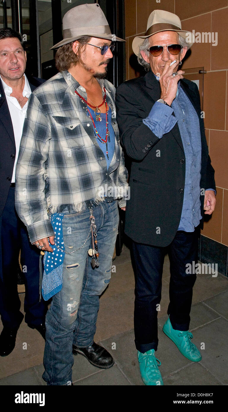 Johnny Depp and Keith Richards both wearing fedora hats and sunglasses ...