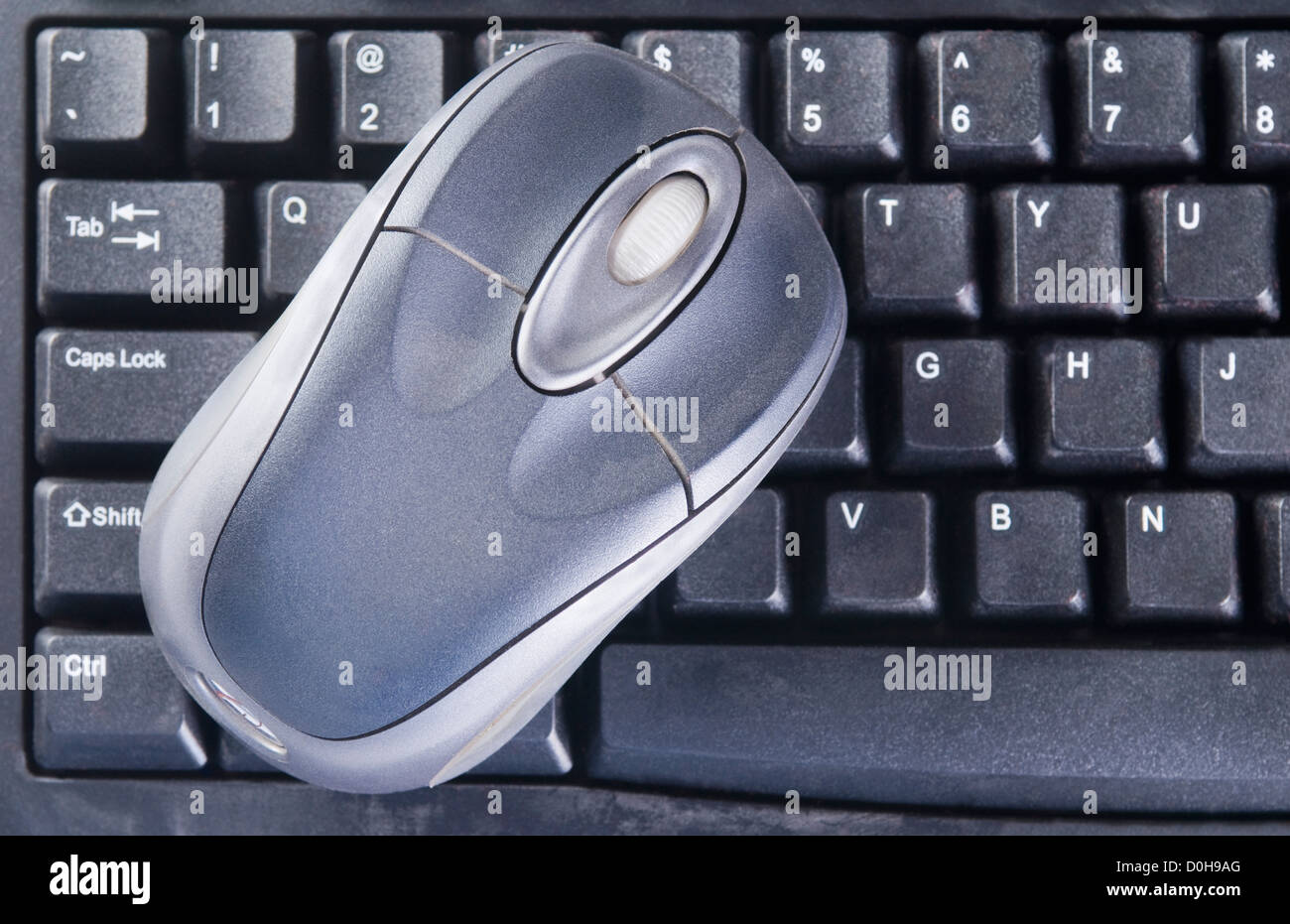 Computer mouse on a computer keyboard Stock Photo - Alamy