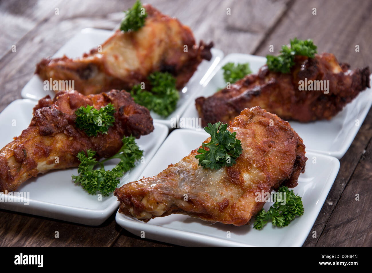 Small plate with Chicken Wings on wooden background Stock Photo - Alamy