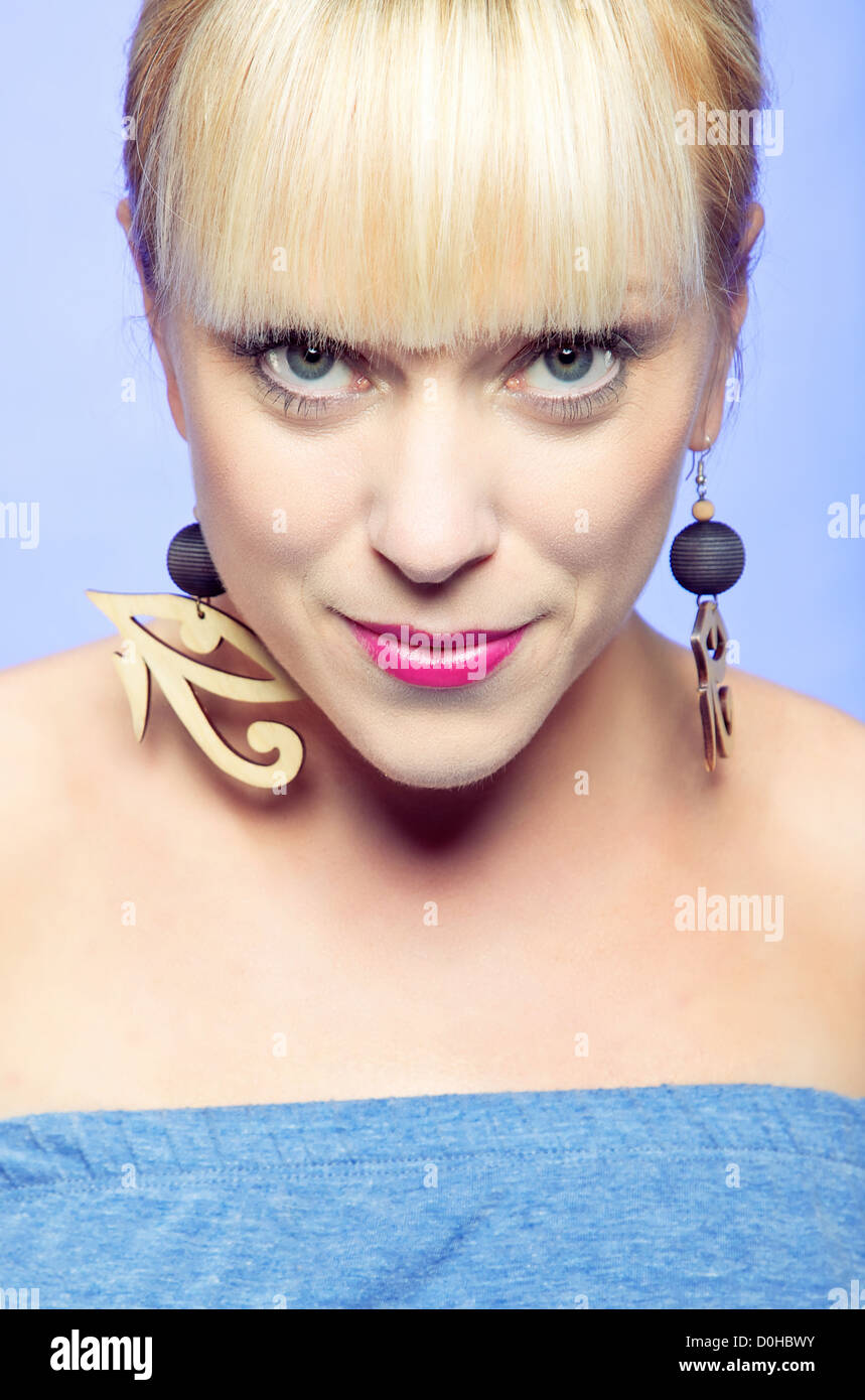 Closeup of a fashionable woman looking at the camera Stock Photo - Alamy