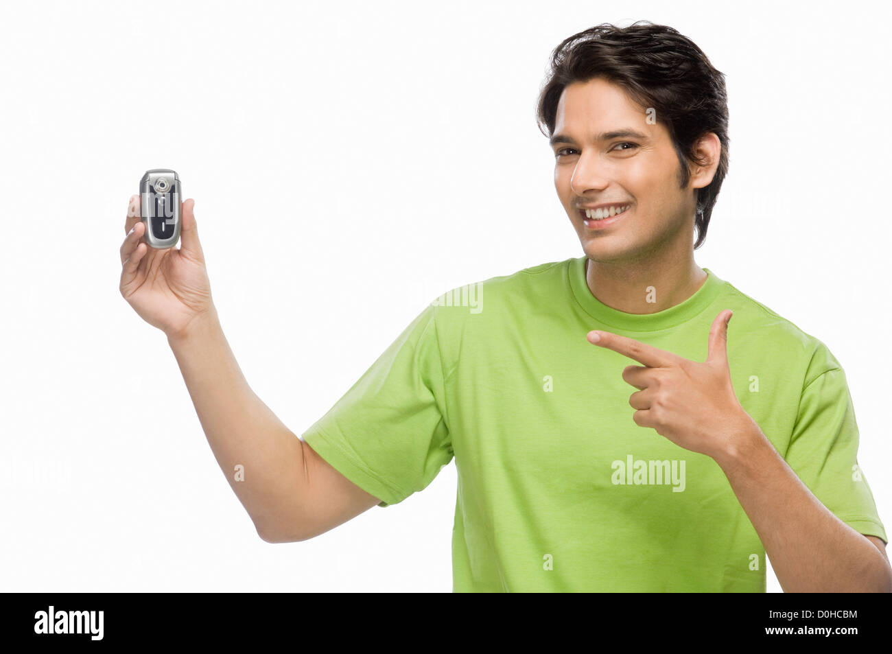 Young man showing a flip phone Stock Photo - Alamy