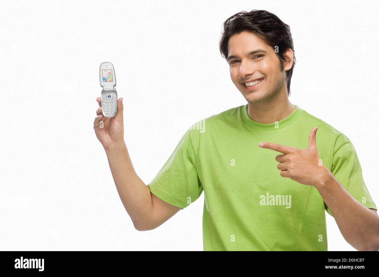 Young man showing a flip phone Stock Photo - Alamy